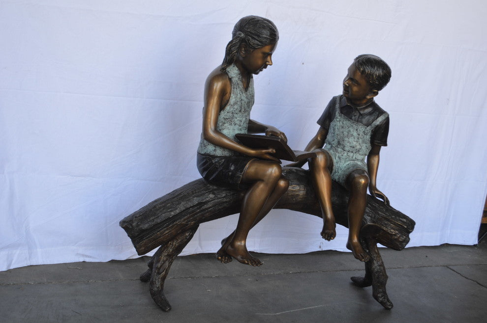 Two Kids on a tree log reading Bronze Statue Large - Size: 44"L x 17"W